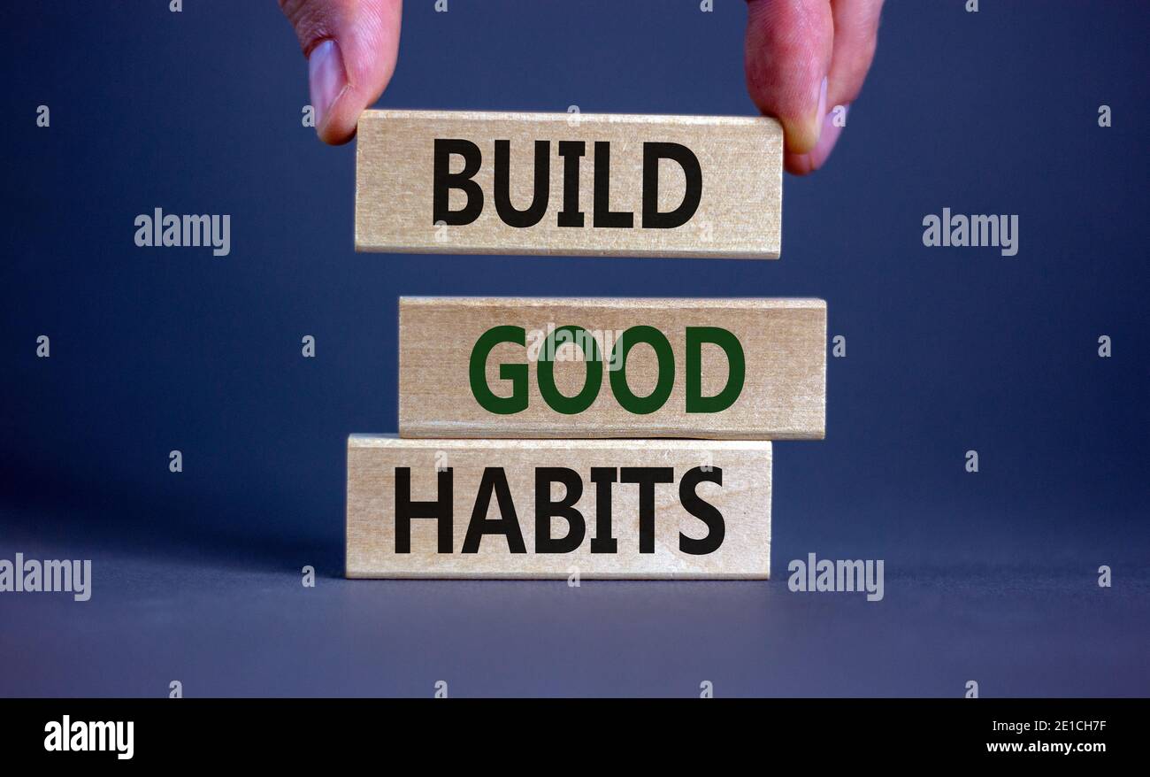 Build good habits symbol. Wooden blocks with words 'build good habits ...