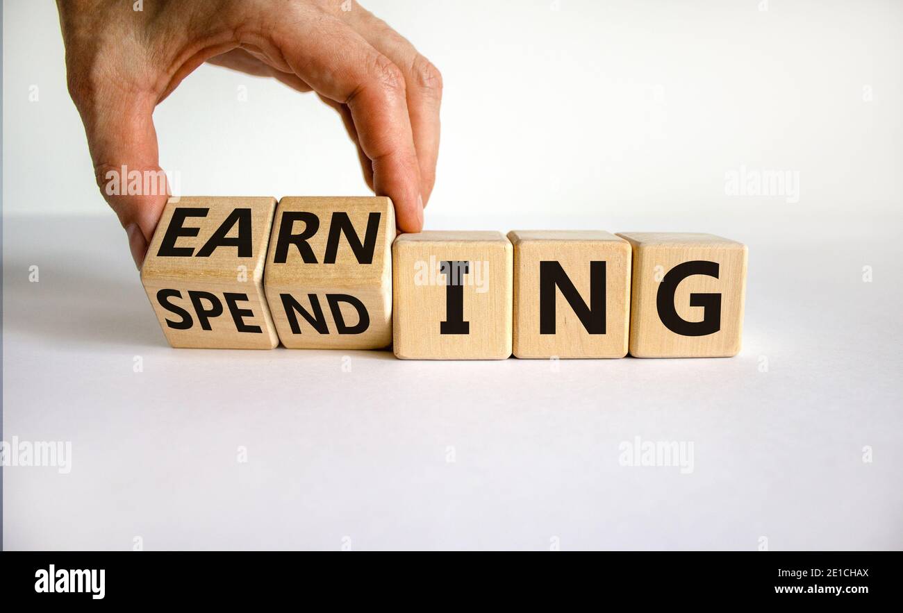 Earning or spending symbol. Businessman hand turns cubes and changes ...