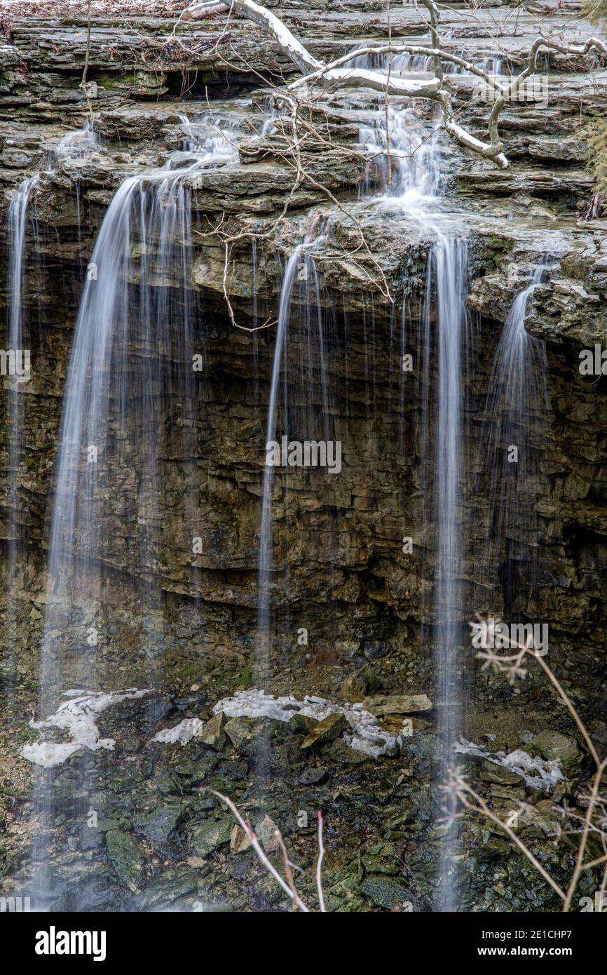 river flowing over the cliff creating a beautiful waterfall Stock Photo ...