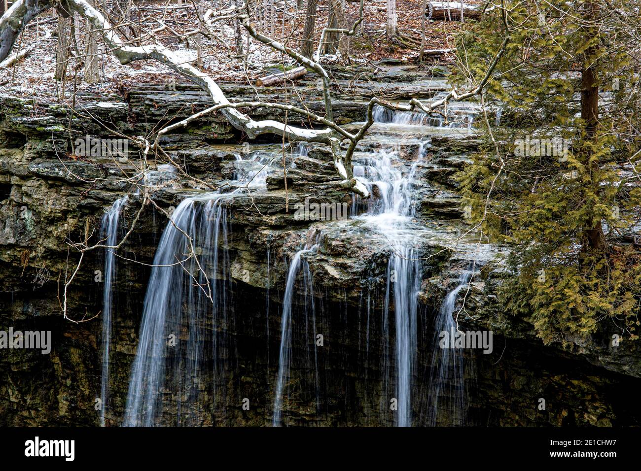 river flowing over the cliff creating a beautiful waterfall Stock Photo ...