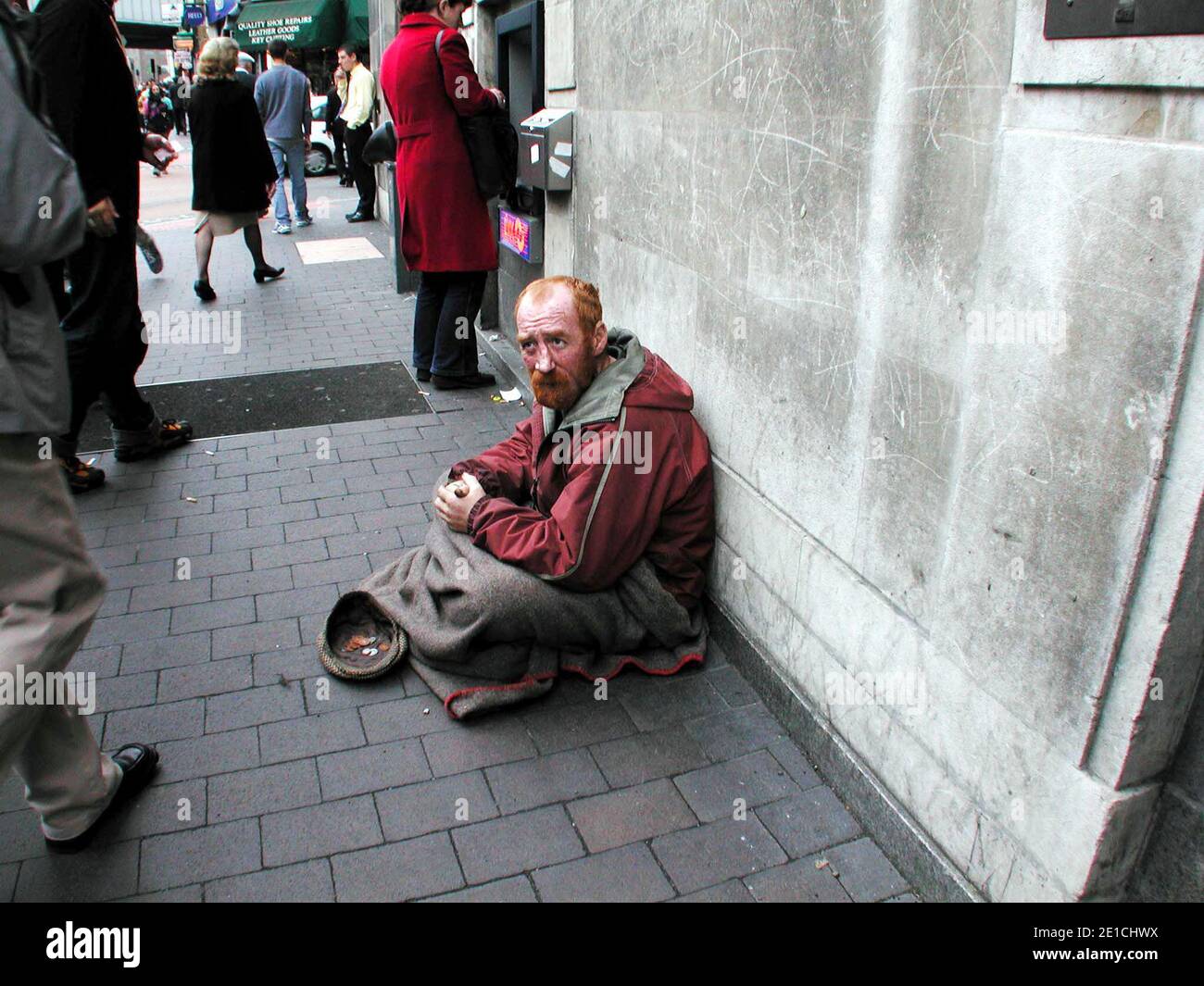Rich poor divide inequality, Homeless vagrant beggar begging by cash ...