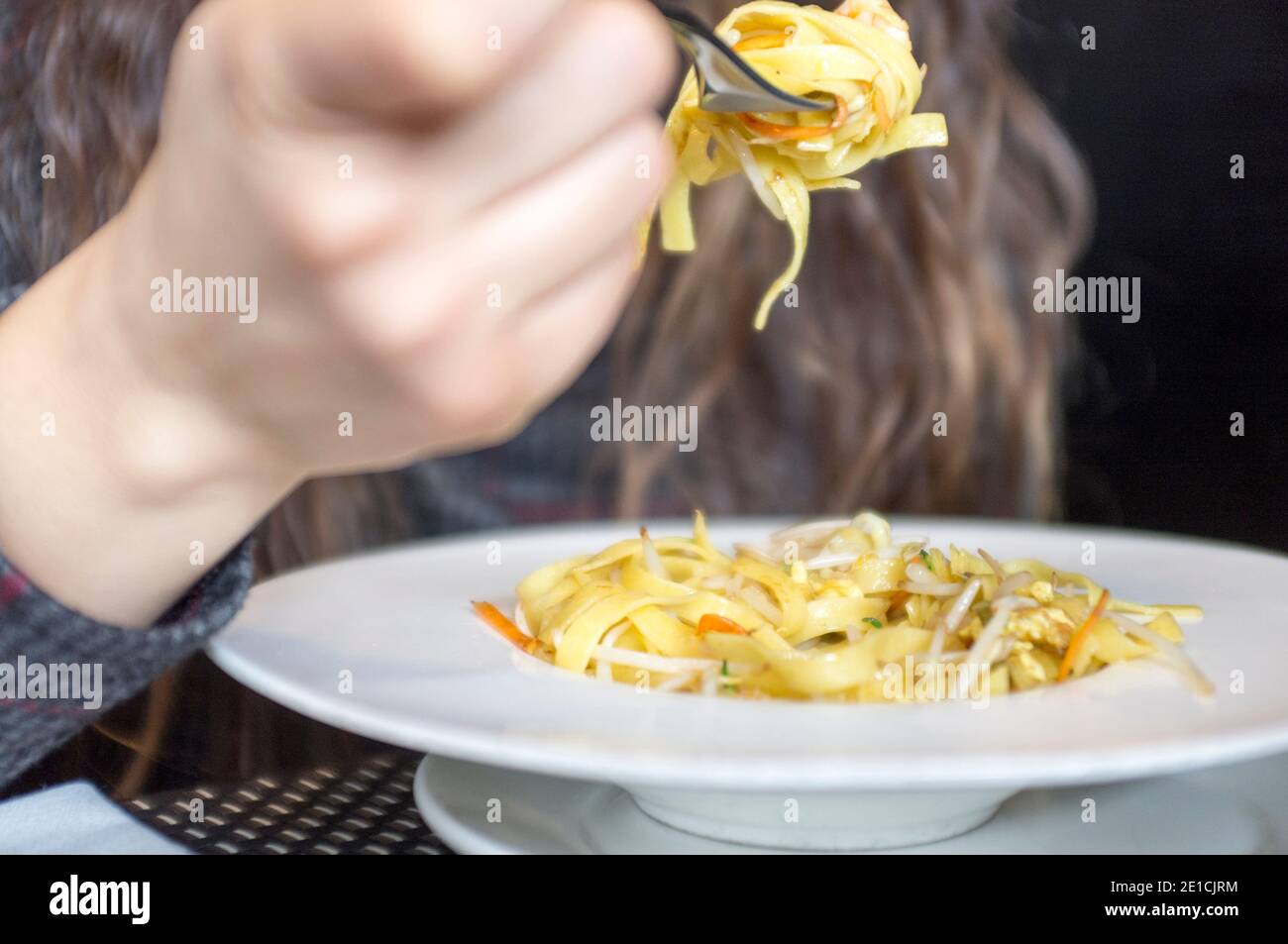 Women eating pasta hi-res stock photography and images - Alamy