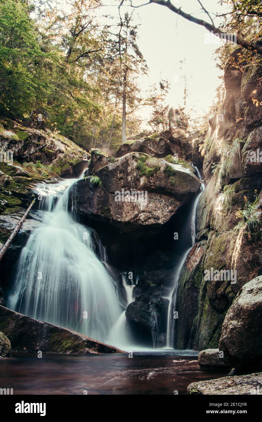 Cerny stream waterfall in Jizera mountains at sunset. A magical ...