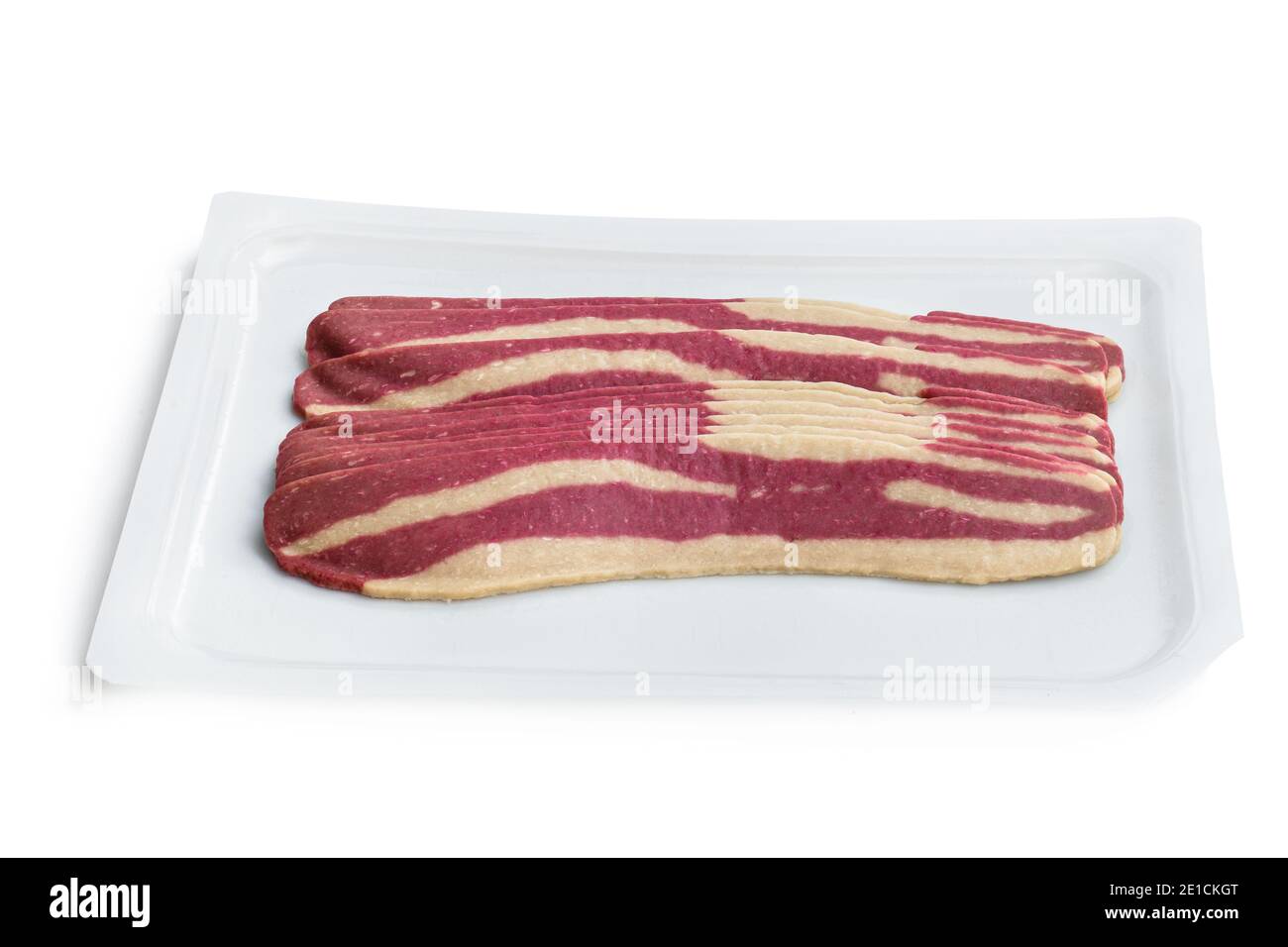 Unsmoked plant-based bacon rashers isolated on white Stock Photo - Alamy