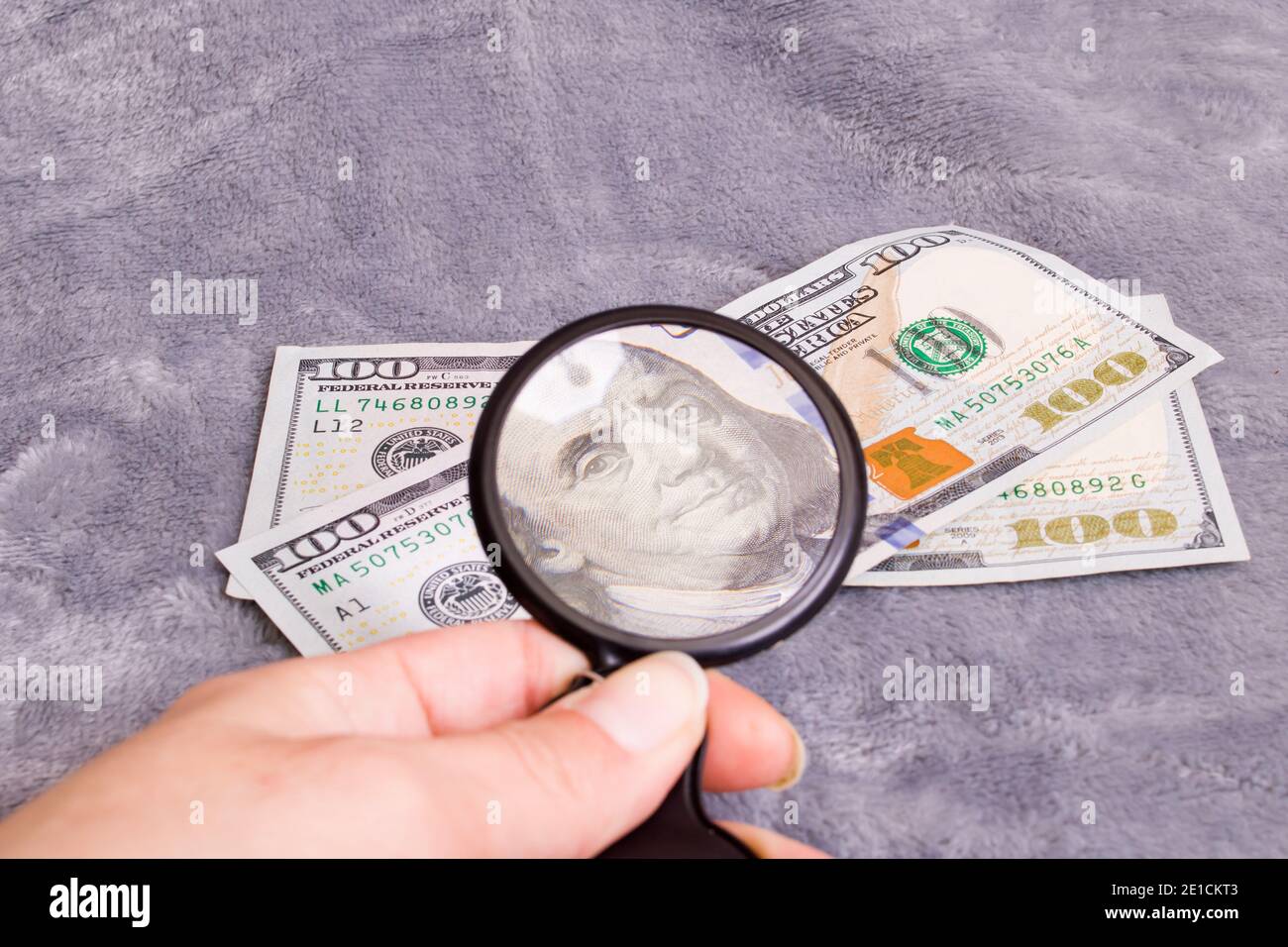 Checking authenticity hi-res stock photography and images - Alamy