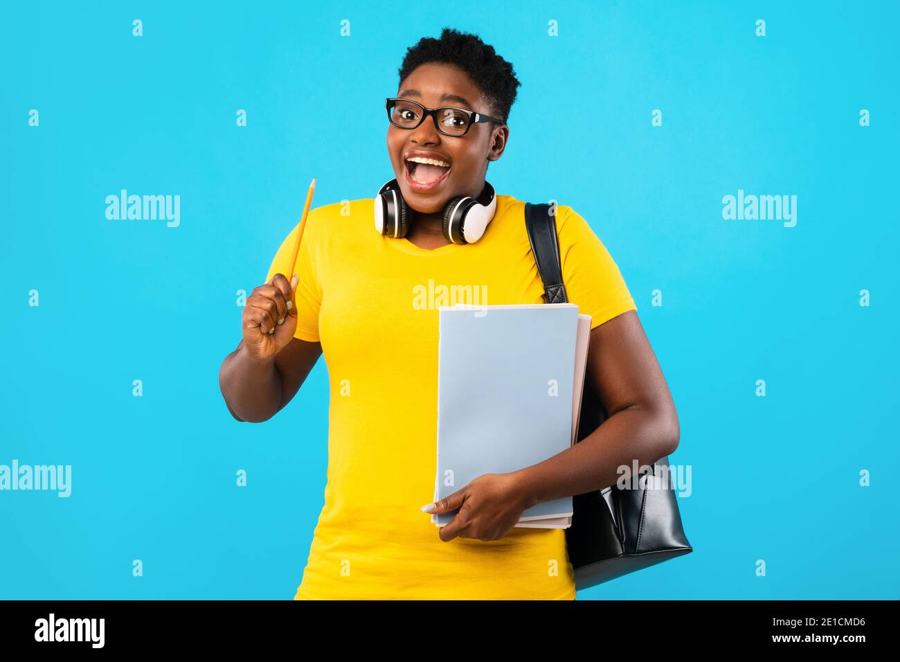 Black Female Student Pointing Pencil Up Having Idea, Blue Background ...