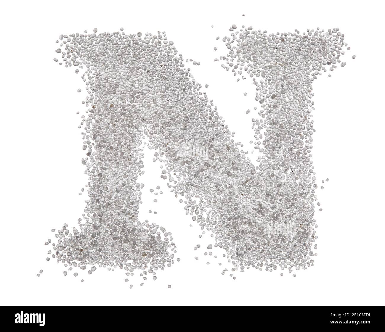 Serif sand letter capital N with a soft edge photographed on a white ...