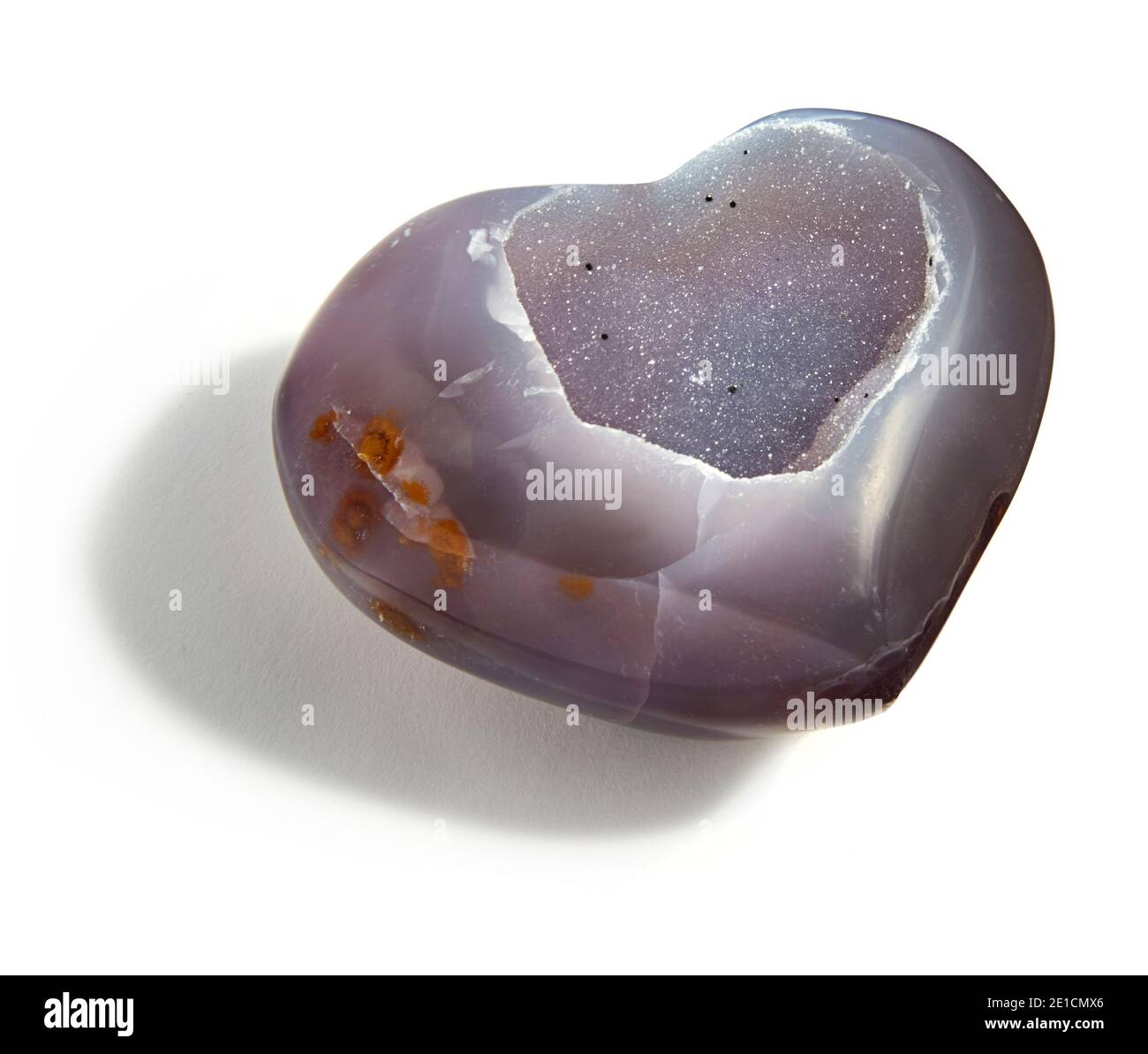 Small purple stone heart designed by Anna Rabinowicz photographed on a ...