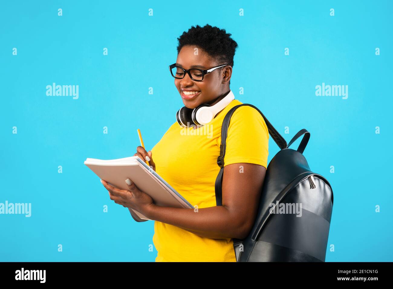 Woman holding books standing hi-res stock photography and images - Alamy