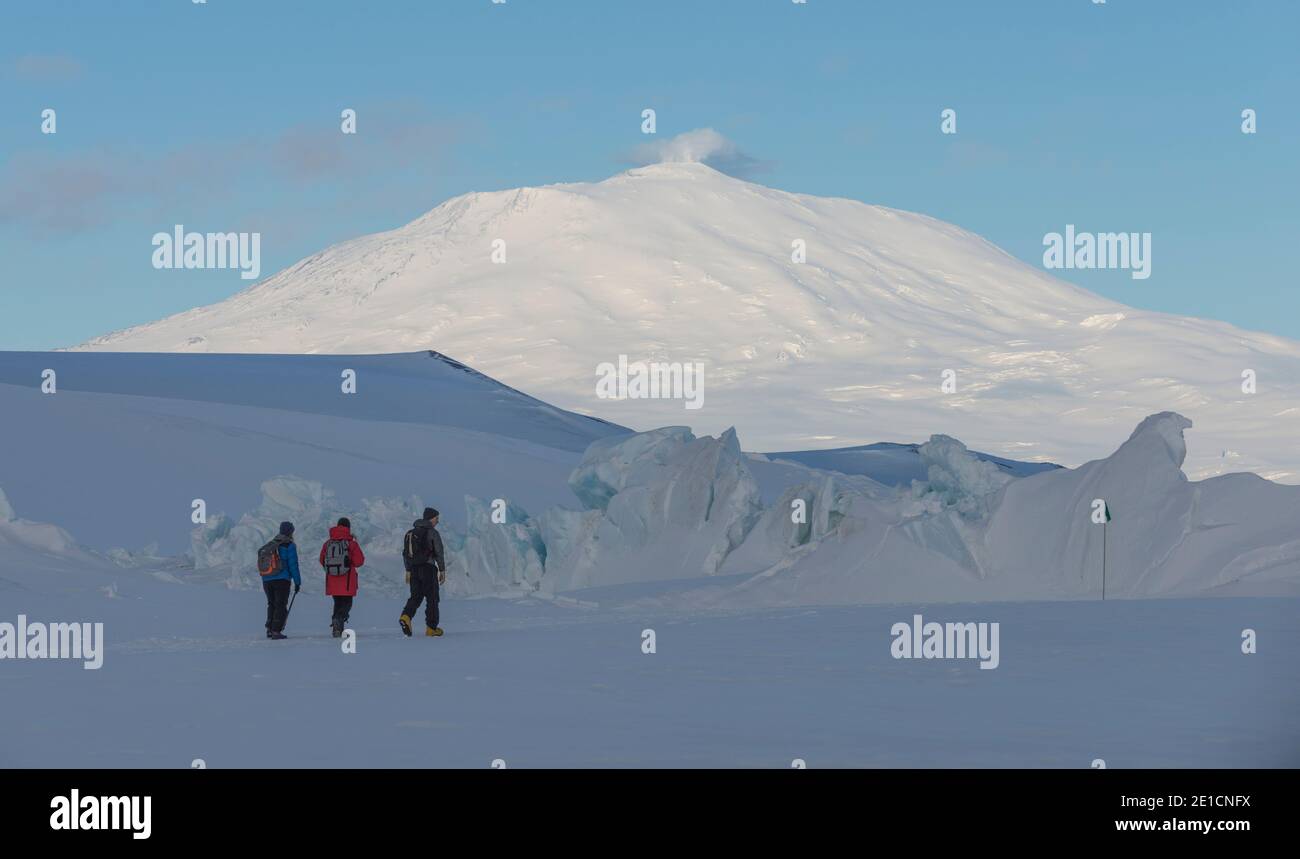 Three people walk around the Scott Base Pressure Ridges Stock Photo - Alamy