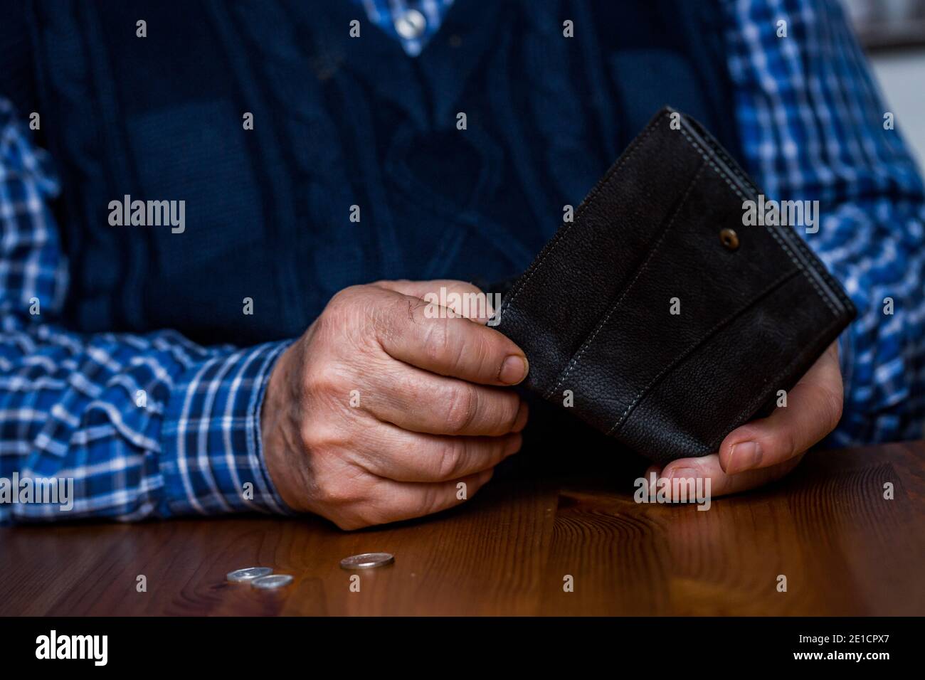 An old senior man showing an empty wallet without money during covid-19 ...