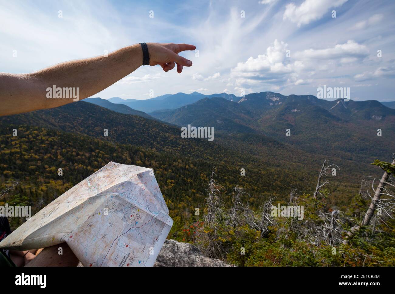 Hiker pointing over peaks of Adirondack Mountains, New York, USA Stock ...