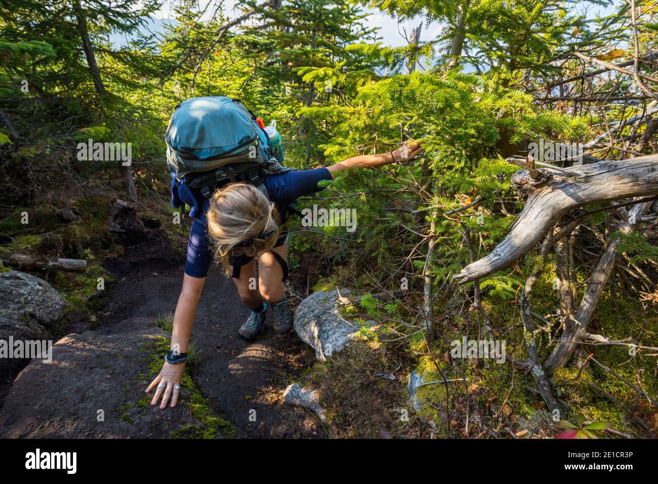Hiker climbing steep slope hi-res stock photography and images - Alamy