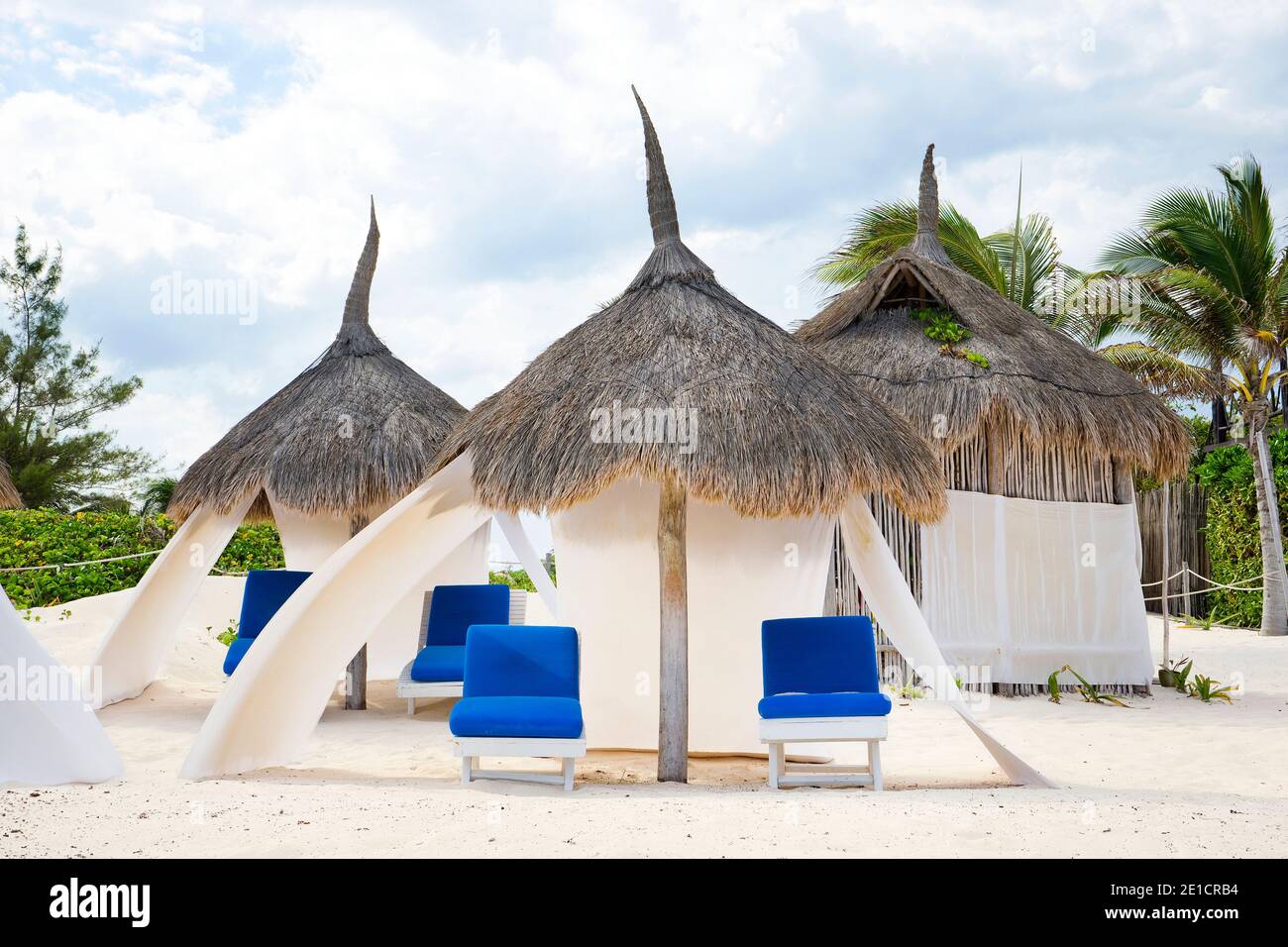 Thatched roof huts on a beach in Tulum, Mexico Stock Photo - Alamy