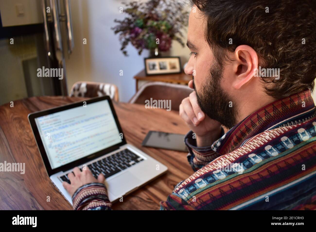 Young man working from home Stock Photo - Alamy