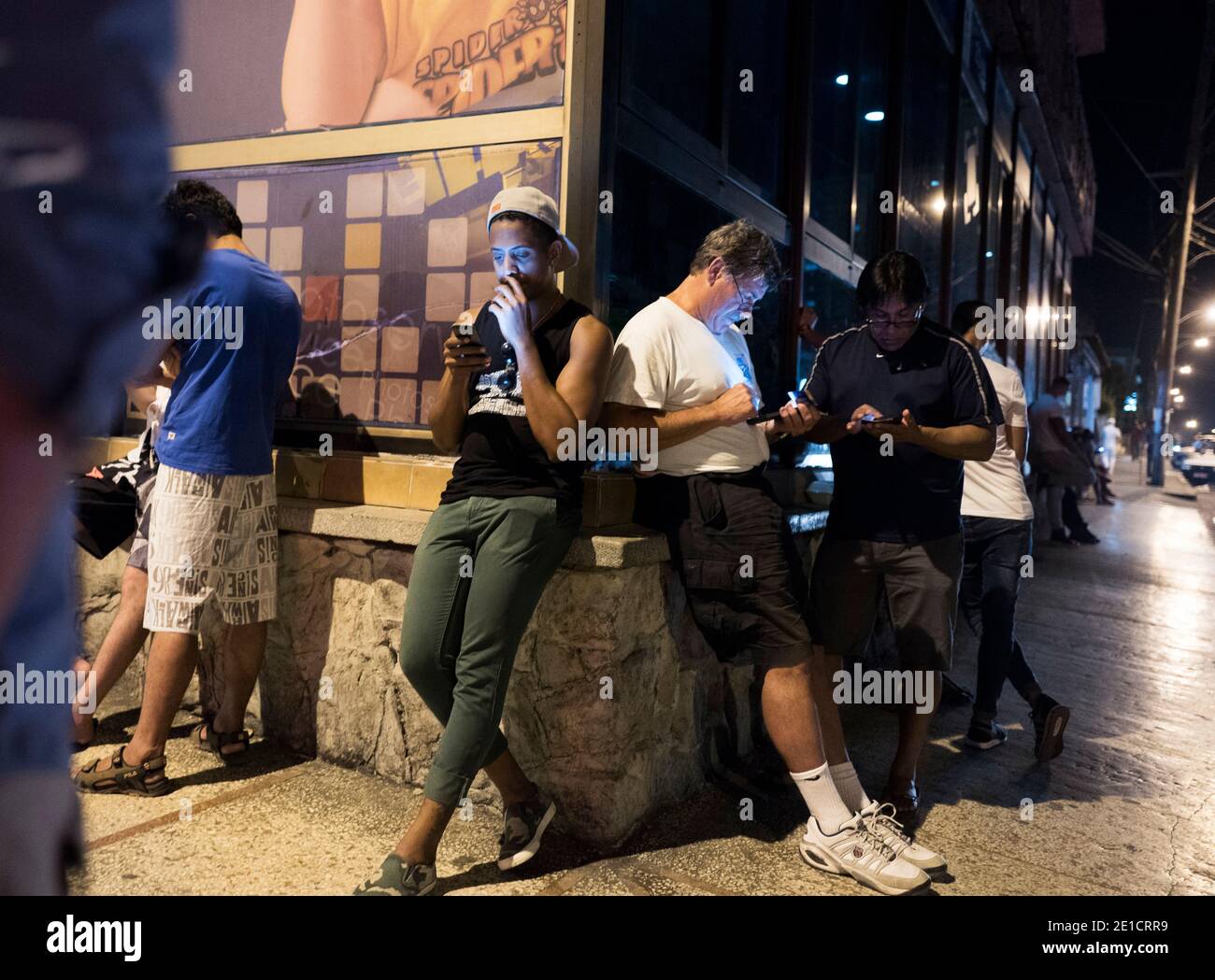 People using smartphones on street, Havana, Cuba Stock Photo - Alamy