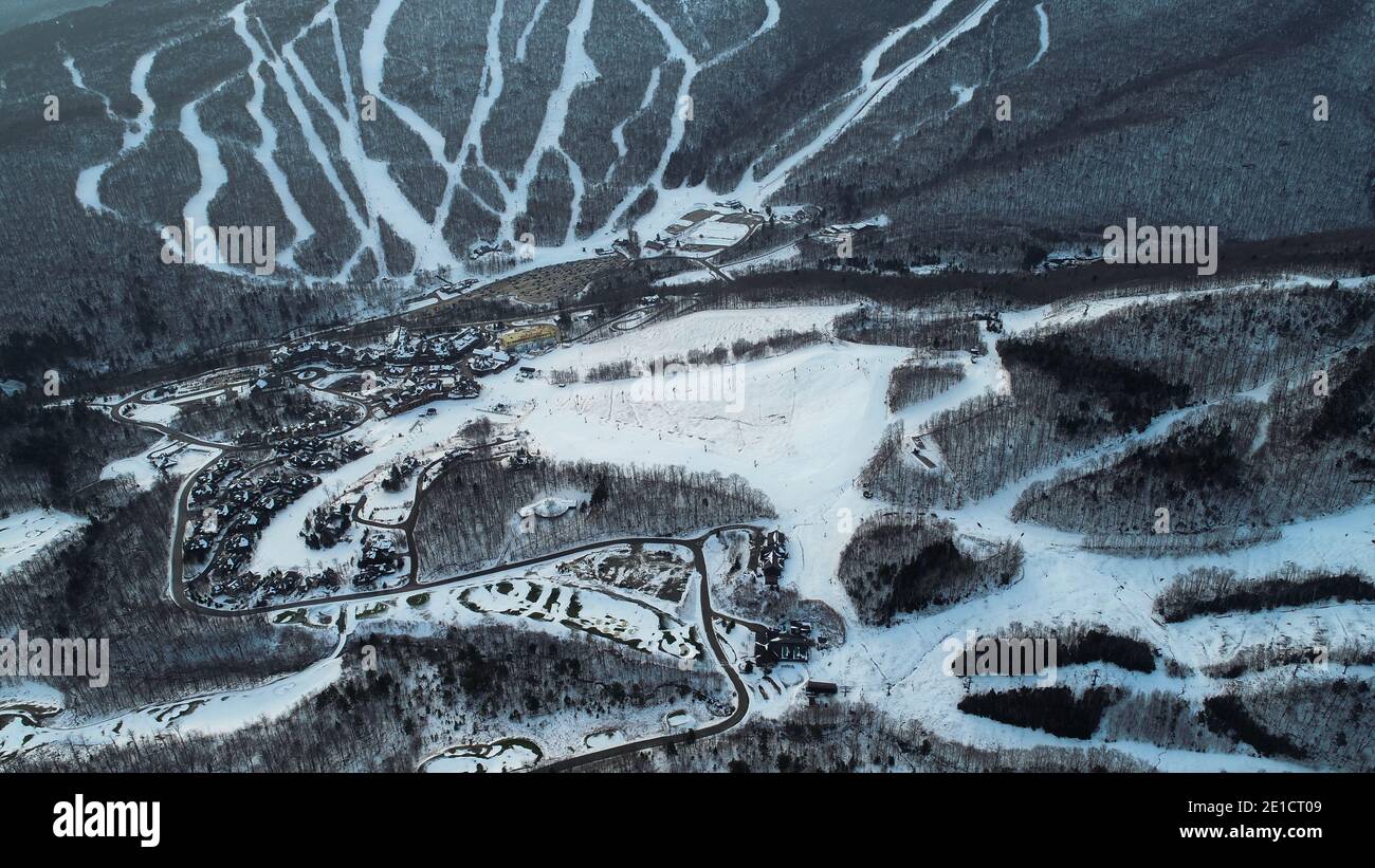 Aerial view to Stowe Mountain Ski Resort in Vermont, USA. Early winter ...