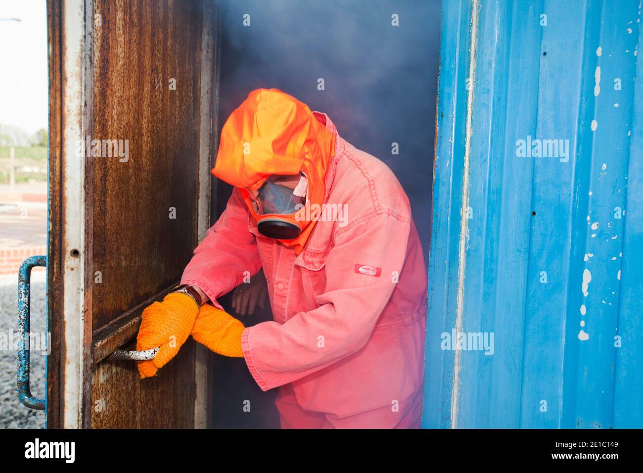 workers in the offshore industry practice escaping from a smoke chamber ...