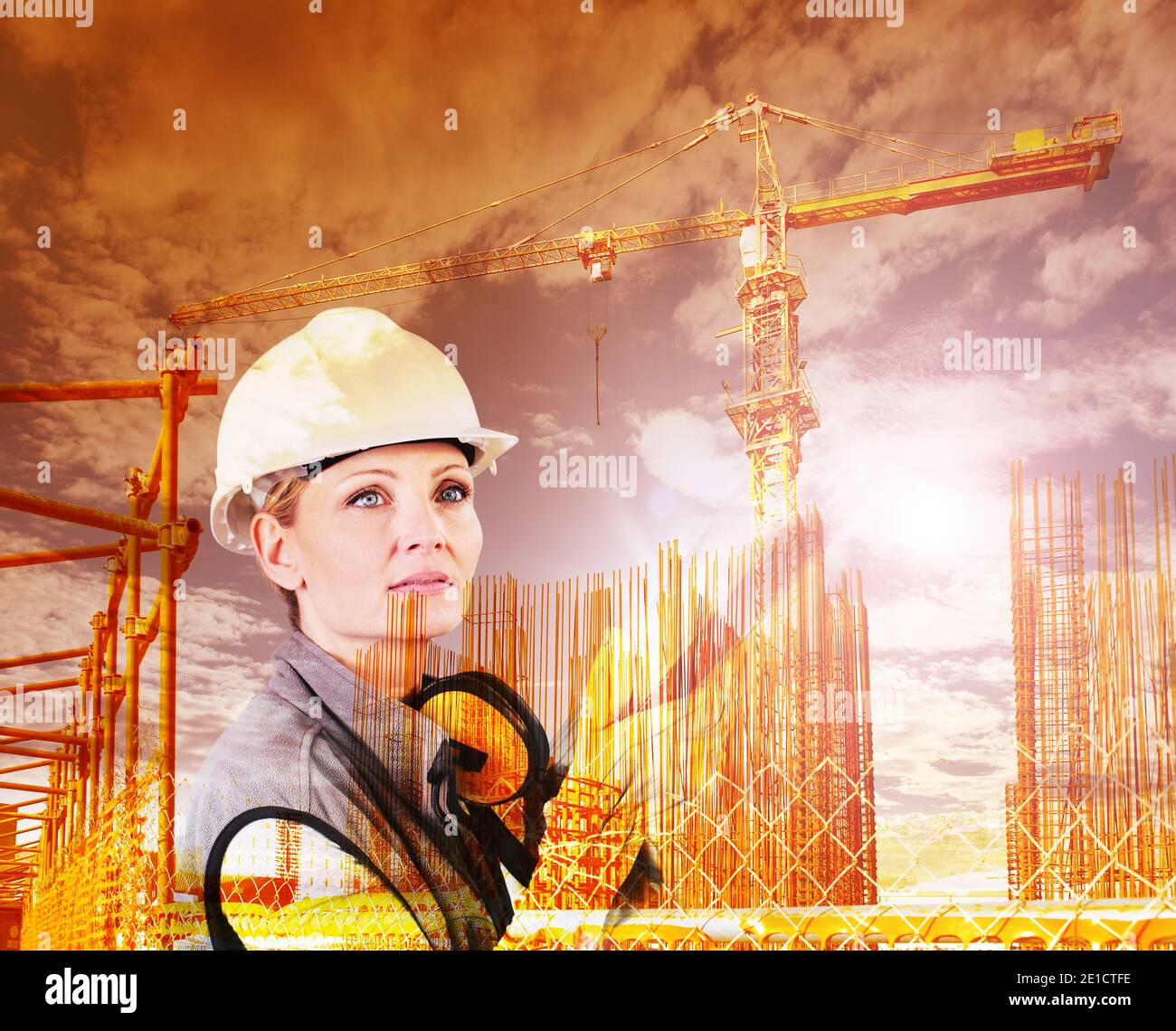 woman construction worker on building site with crane with safety hard ...