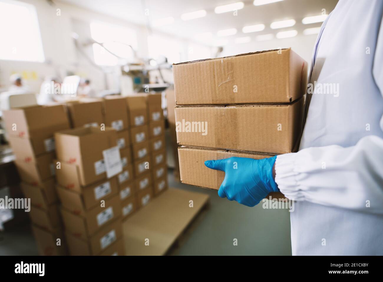 Closeup of hands full of boxes Stock Photo - Alamy