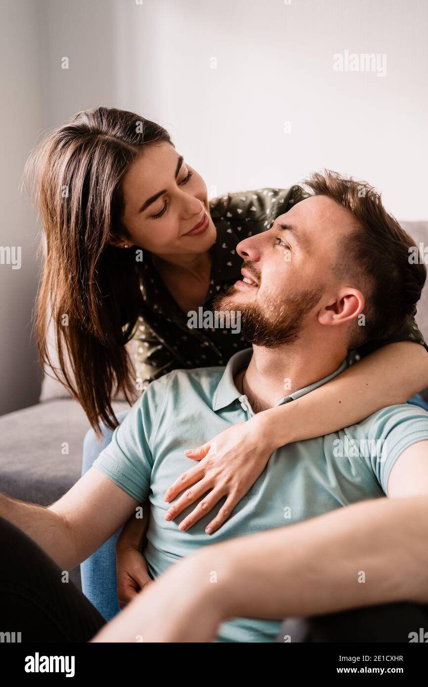 Couple flirting on sofa hi-res stock photography and images - Alamy