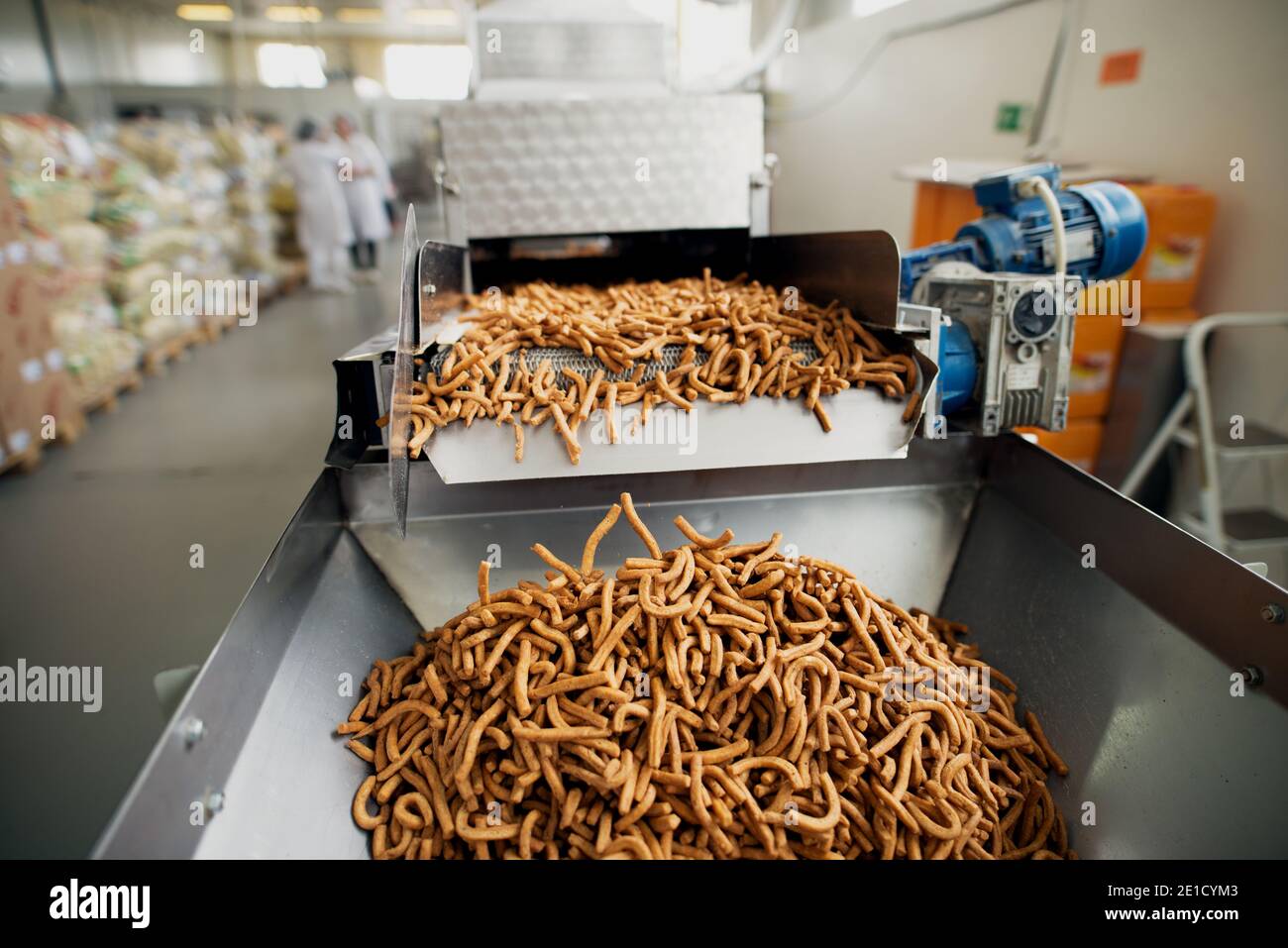 Closeup of salty snacks in food factor production line Stock Photo - Alamy