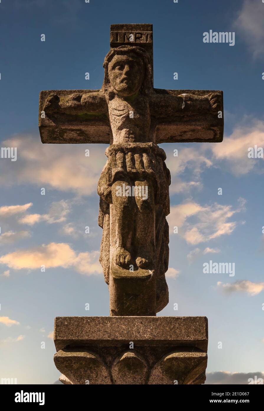 Romanesque symbol of the cross on the Camino de Santiago with sunset ...