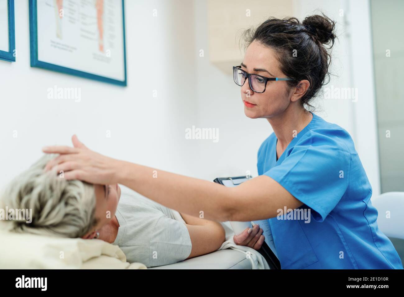 Doctor checking temperature hi-res stock photography and images - Alamy