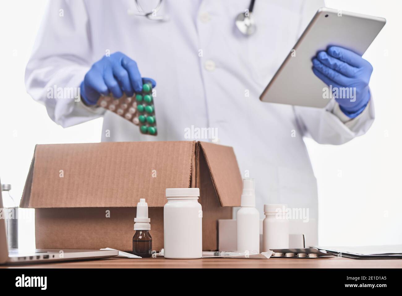 Various medications being collected into a box for shipping Stock Photo ...