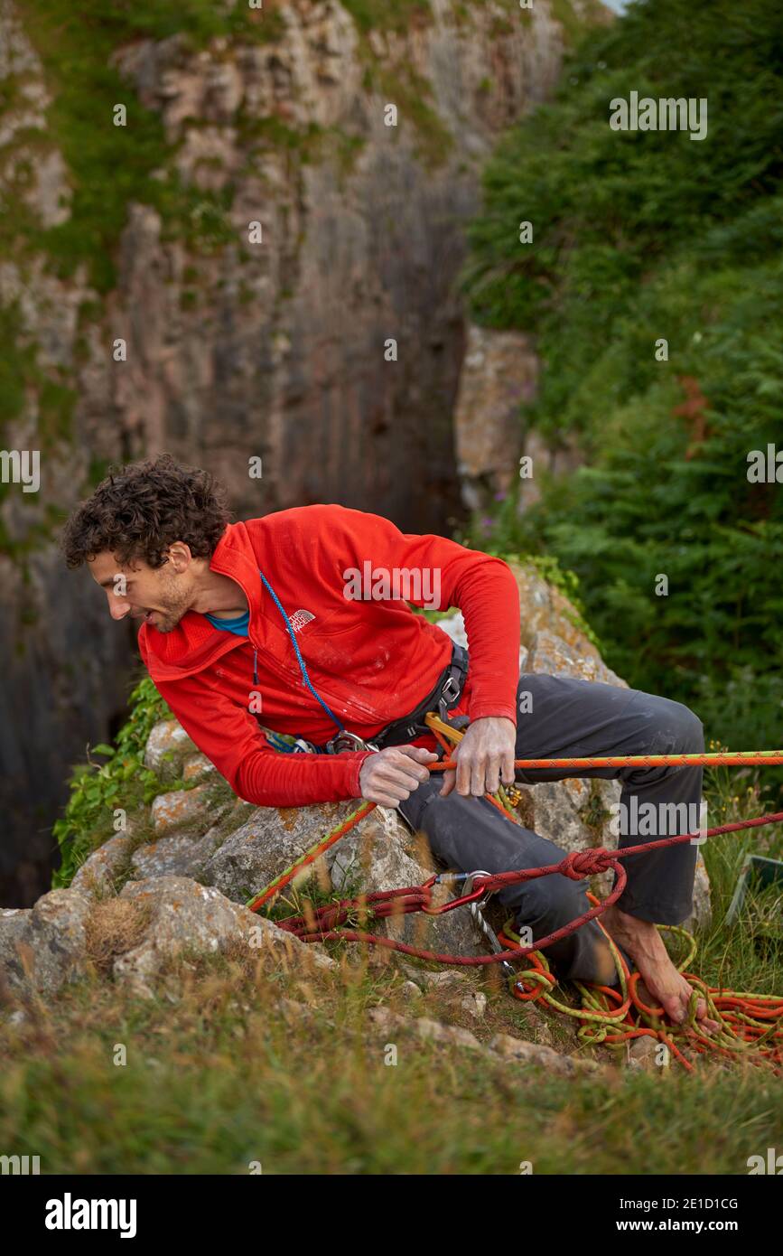 Full length shot of a male rock climber, Pembroke, Wales, UK Stock ...