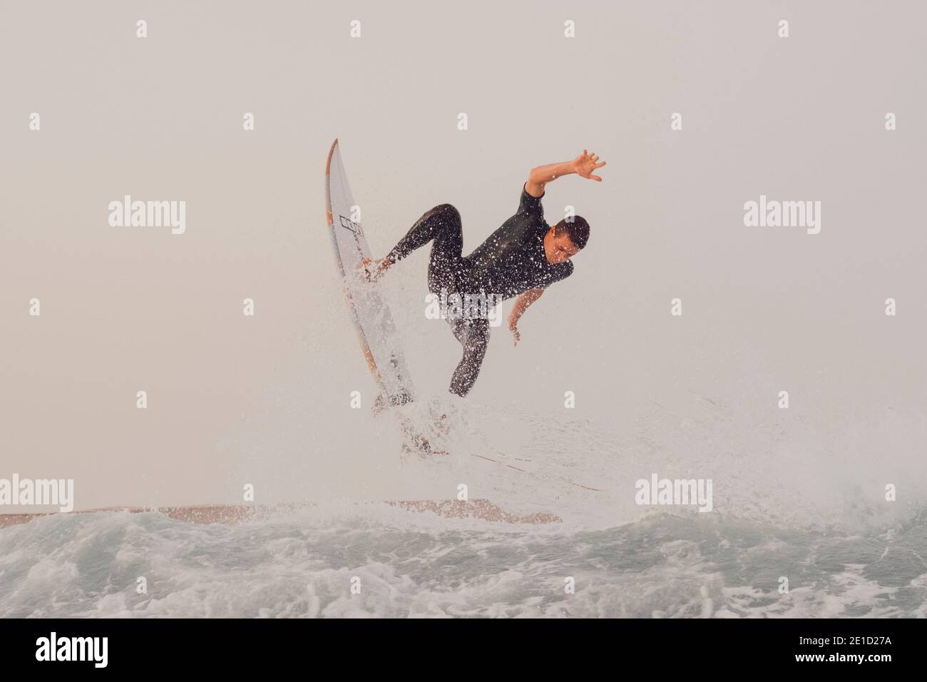 Surfer in mid-air Stock Photo - Alamy