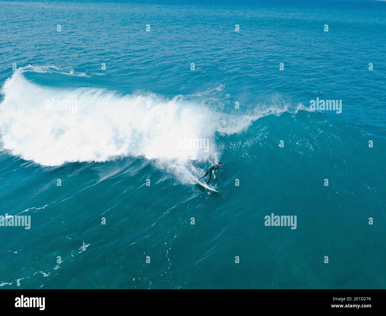 Aerial view of surfer in sea Stock Photo - Alamy