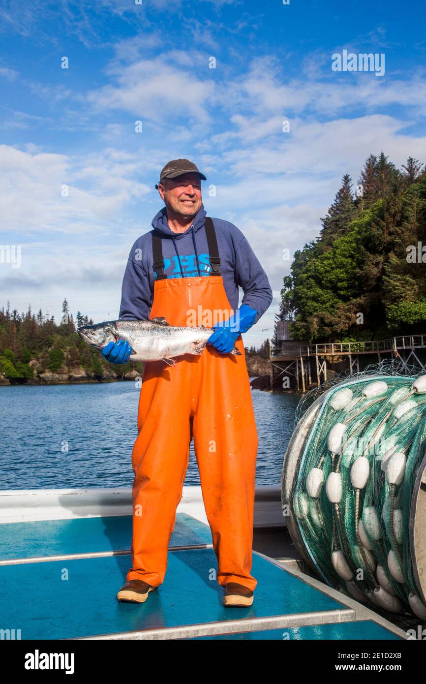 Man holding small fish hi-res stock photography and images - Alamy