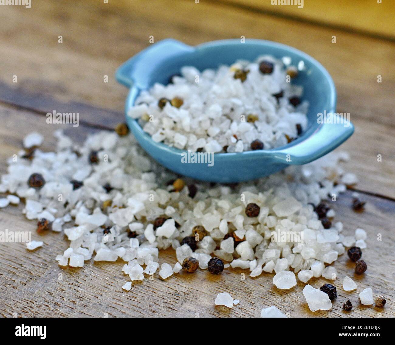 Sea salt with pepper and spices. Sea salt in wooden bowl on wooden ...