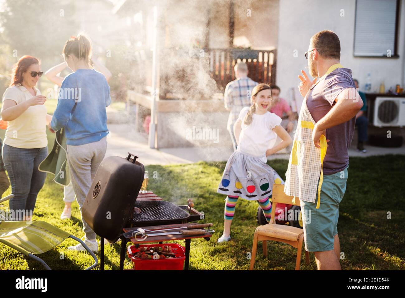 Family having dinner garden house hi-res stock photography and images ...