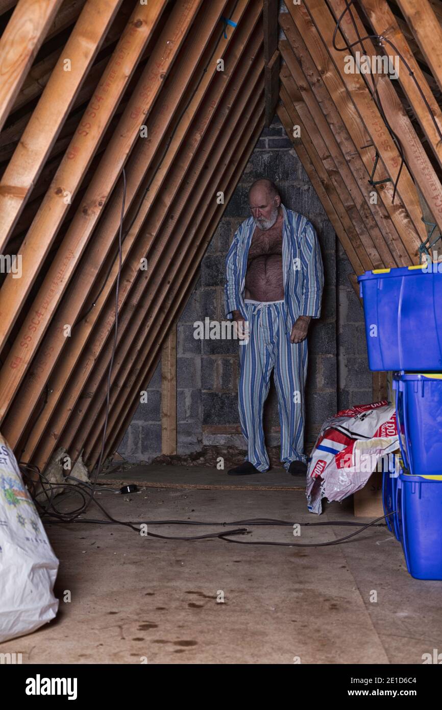 Mentally challenged senior man living in the attic Stock Photo - Alamy