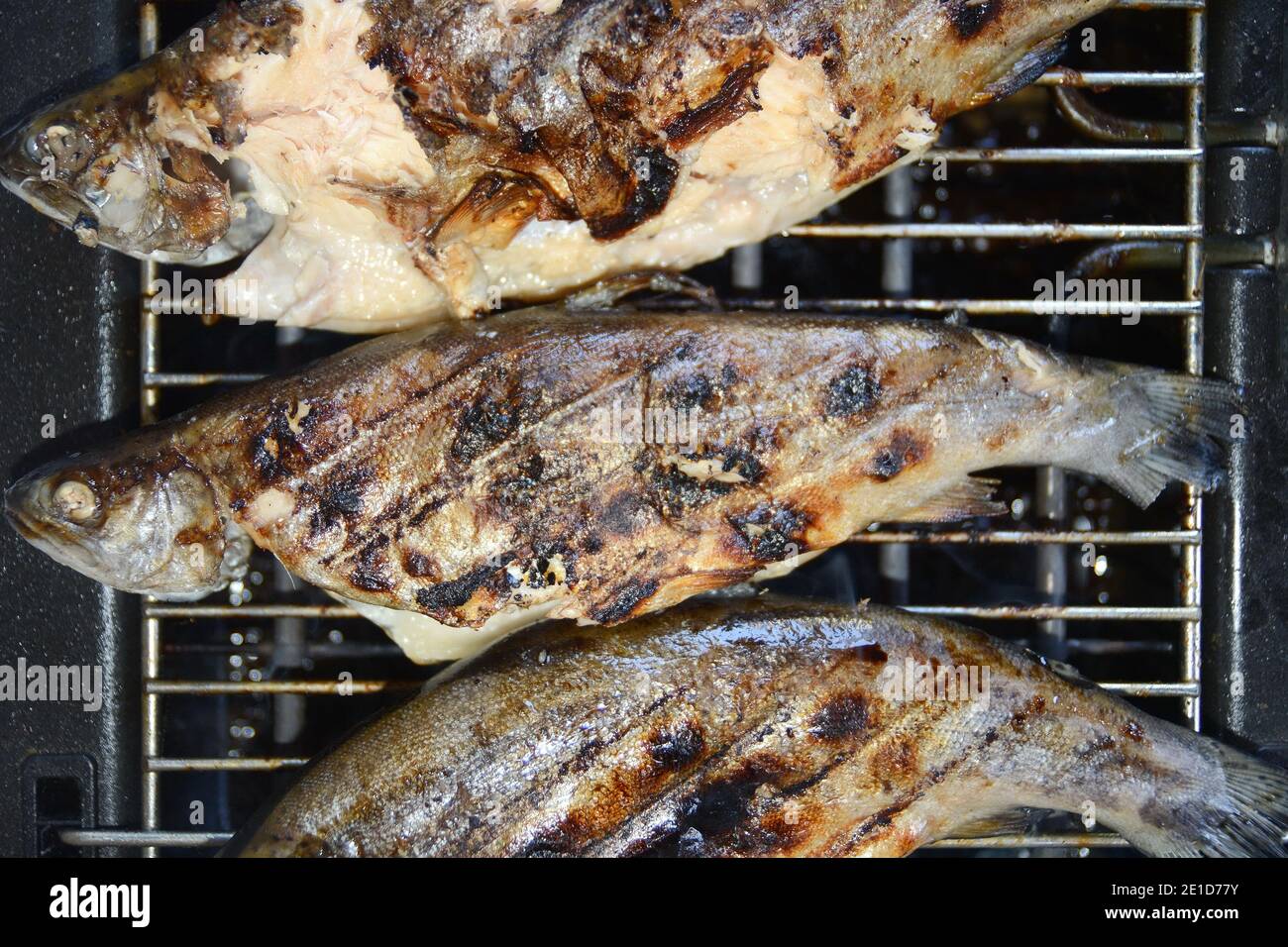 Barbecue with fish. Grilled mackerel fish. Fatty, oily fish is an ...
