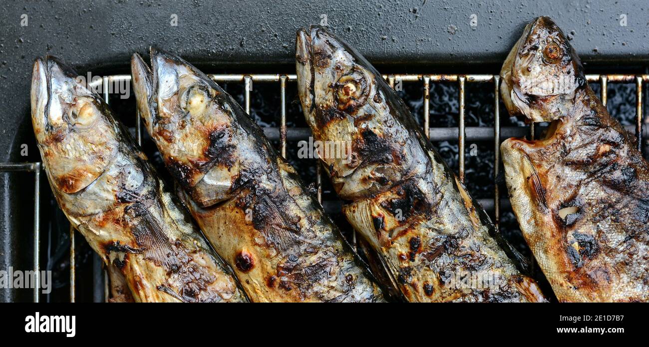 Barbecue with fish. Grilled mackerel fish. Fatty, oily fish is an ...