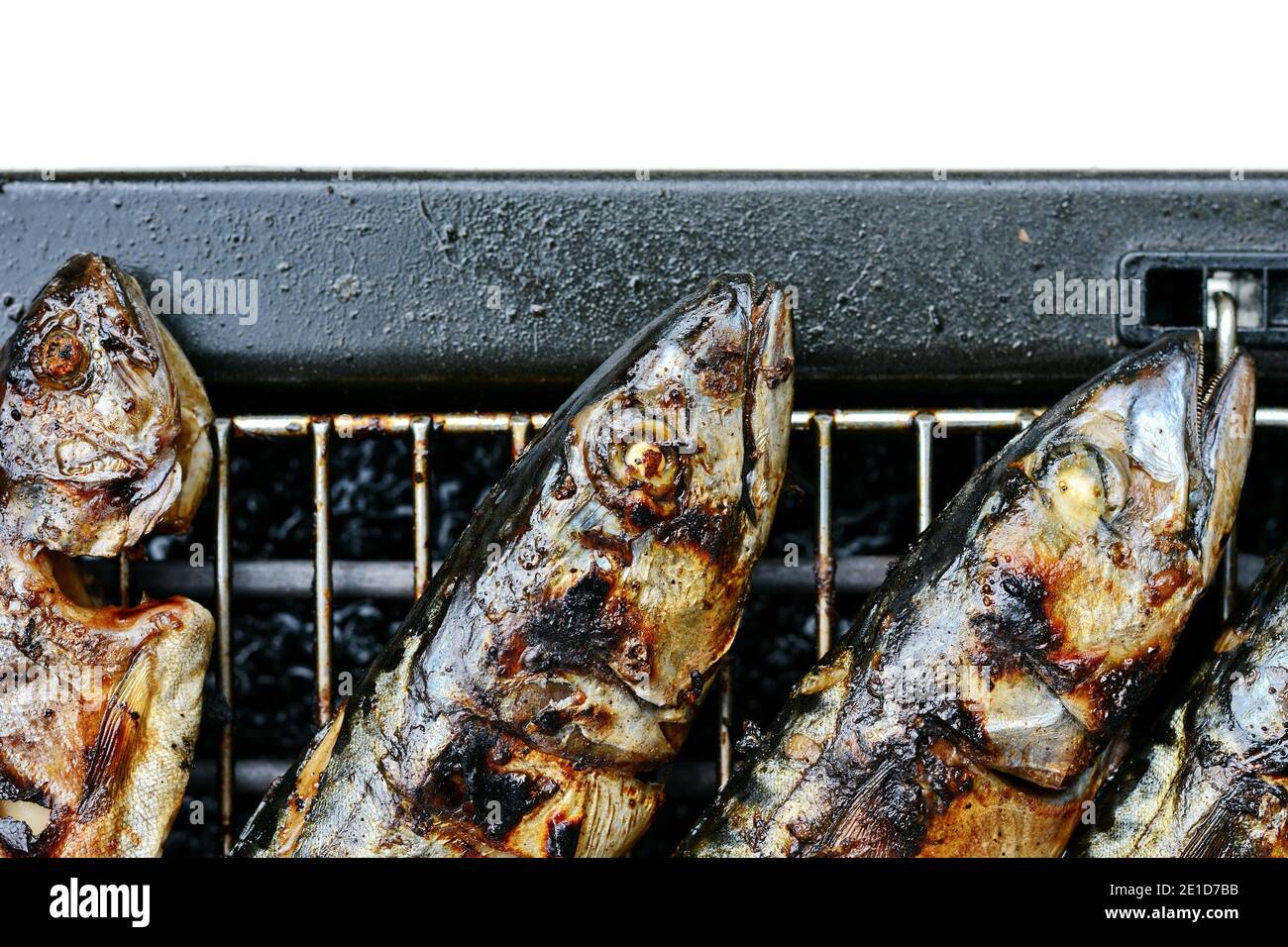 Barbecue with fish. Grilled mackerel fish. Fatty, oily fish is an ...