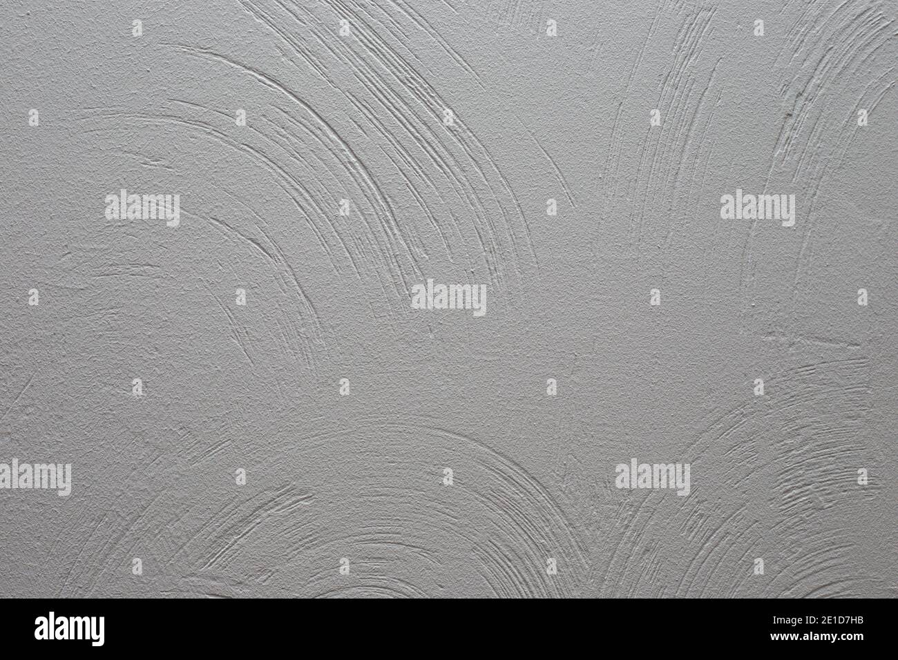 Decorative plaster. Wall with rounded stripes of applied plaster ...