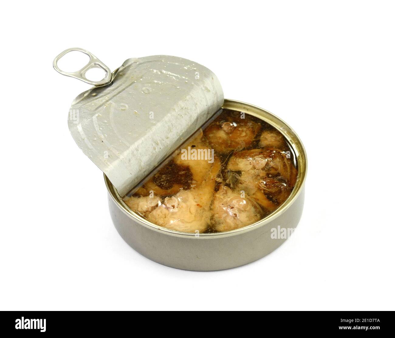 Canned fish isolated on white. Closeup of an open can of canned ...