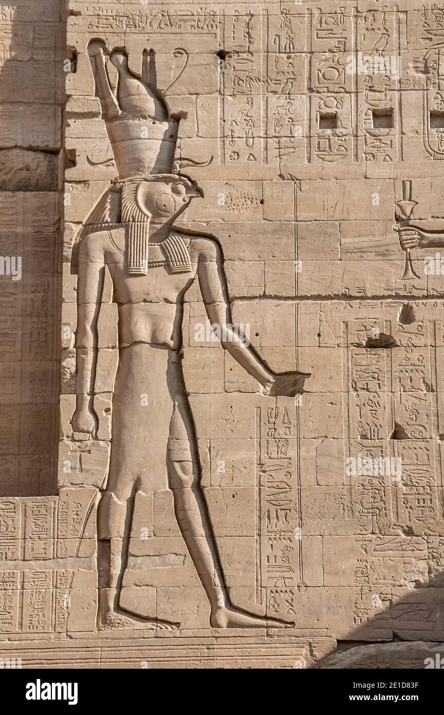 This is a wall relief engraving of the Egyptian God Horus with is hawk ...