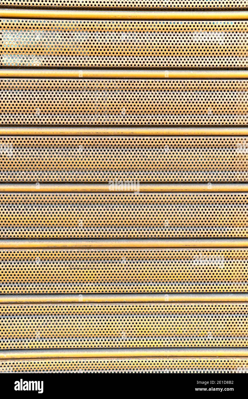 Corrugated perforated metal sheet surface with perforations and holes ...