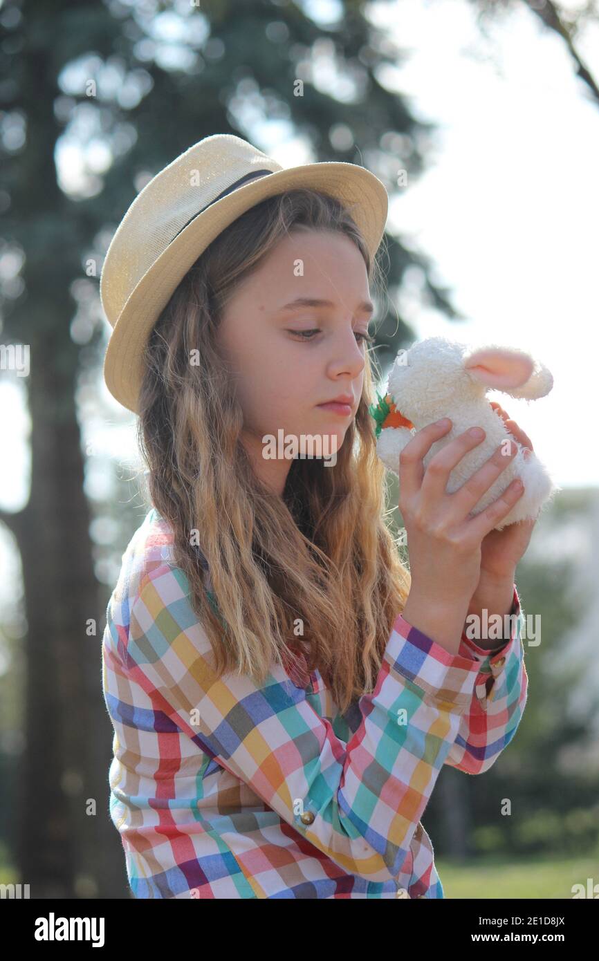 so cute girl with rabbit easter time Stock Photo - Alamy