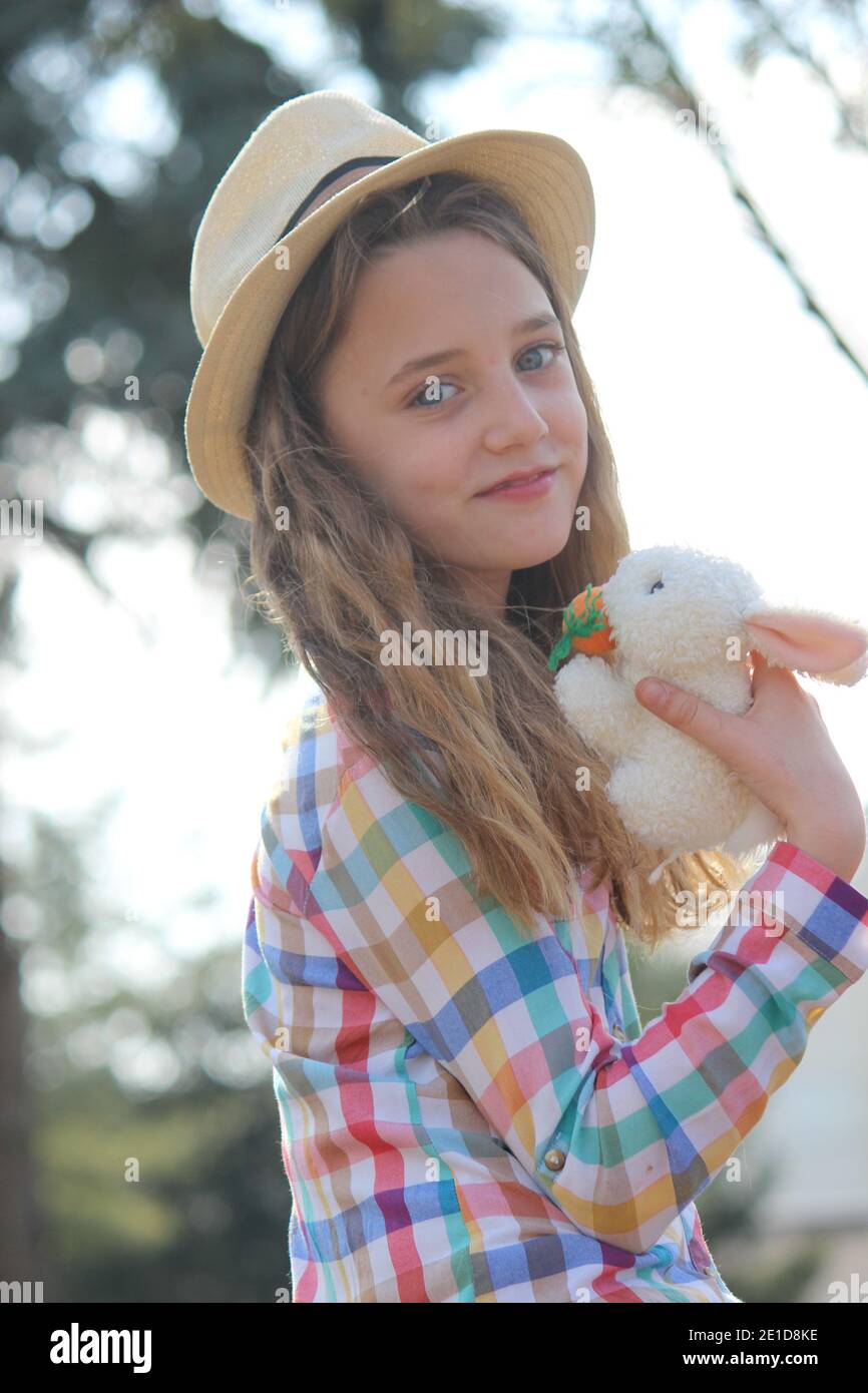 so cute girl with rabbit easter time Stock Photo - Alamy