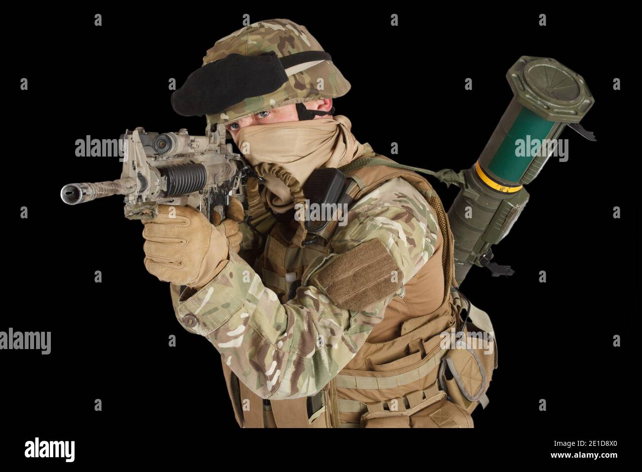 US ARMY special forces soldier firing assault rifle on black background ...