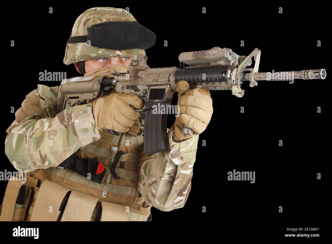 US ARMY special forces soldier firing assault rifle on black background ...
