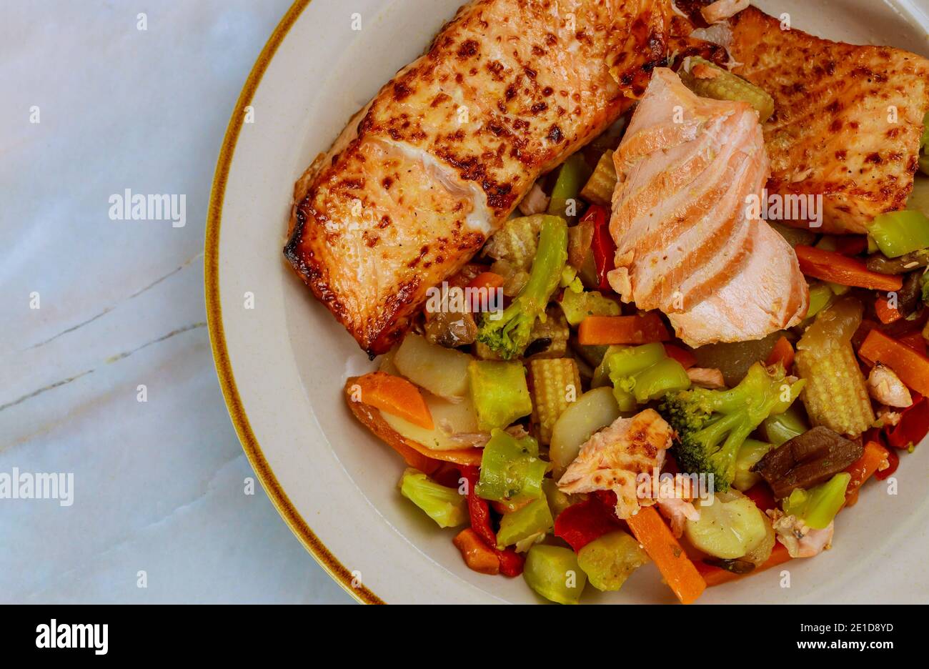 Baked salmon garnished with asian vegetables. Top view. Close up Stock ...