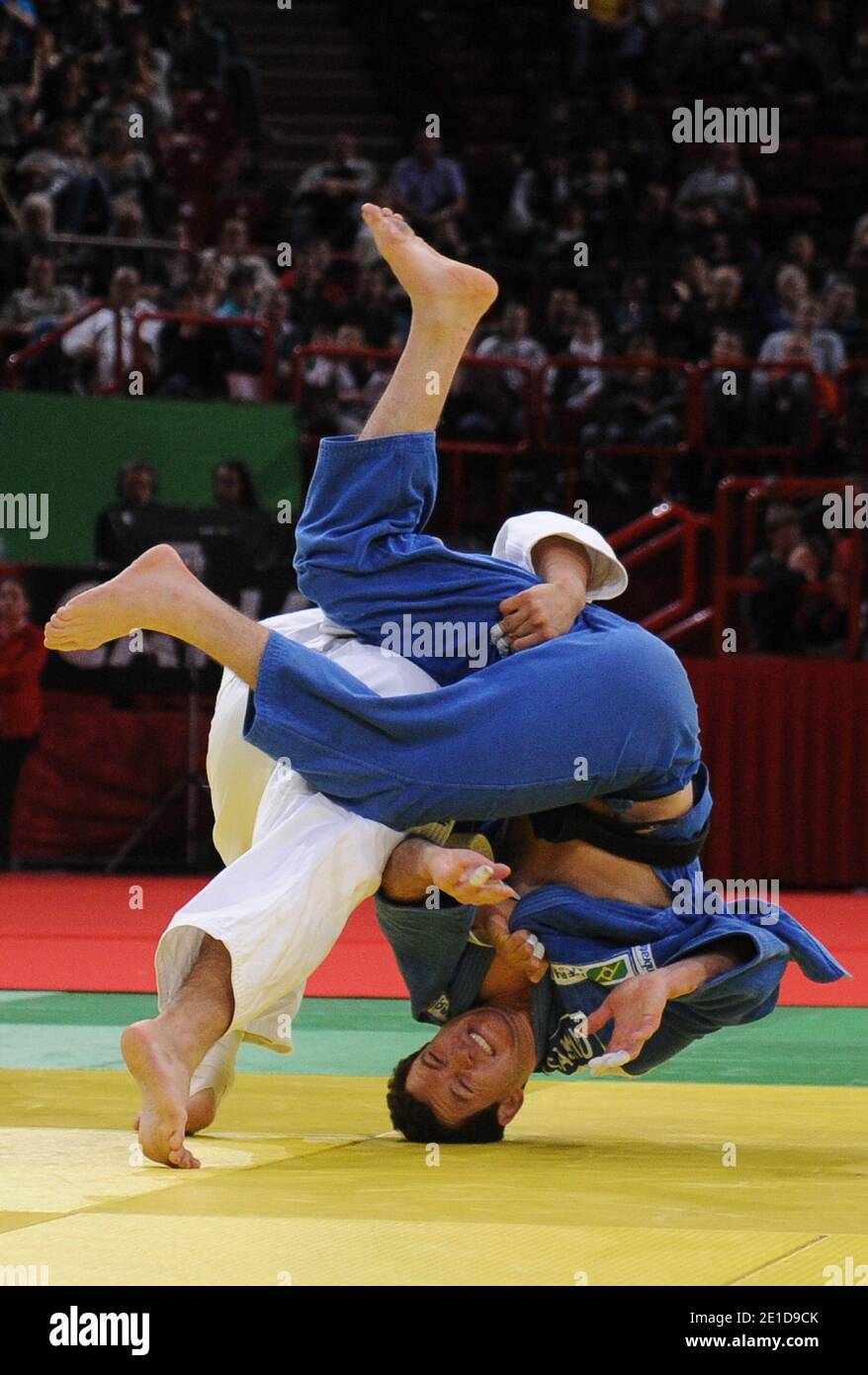 Brasil's Tiago Camilo (blue) battles with Japan's Daiki Nishima (White ...
