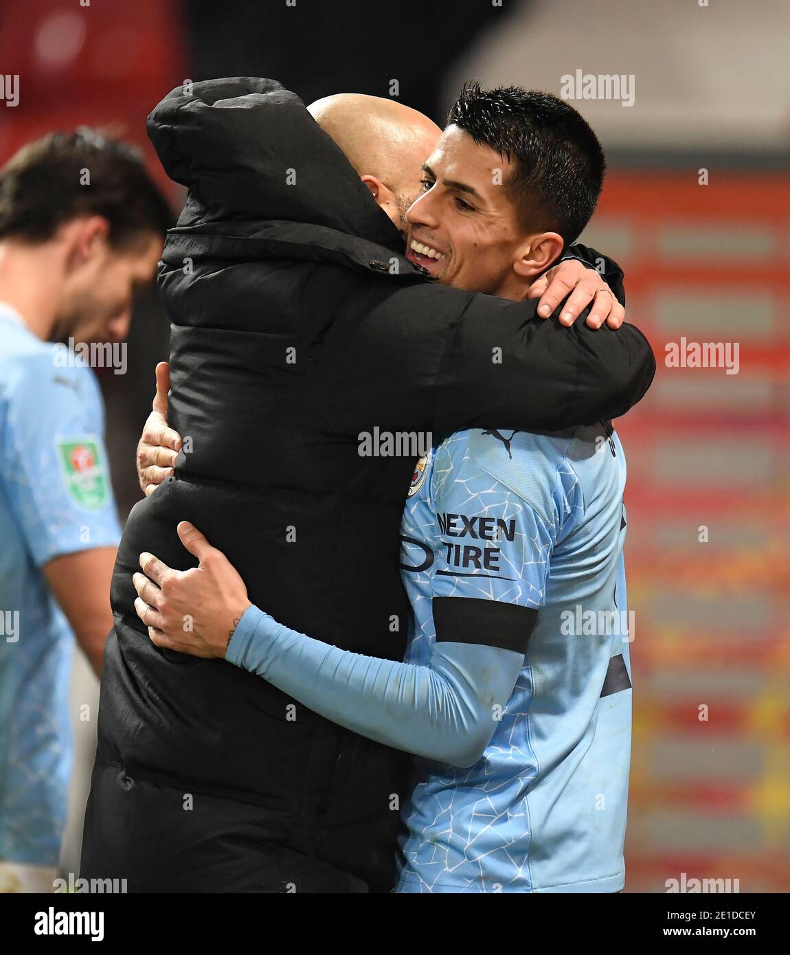 Manchester City's Joao Cancelo celebrates with manager Pep Guardiola ...